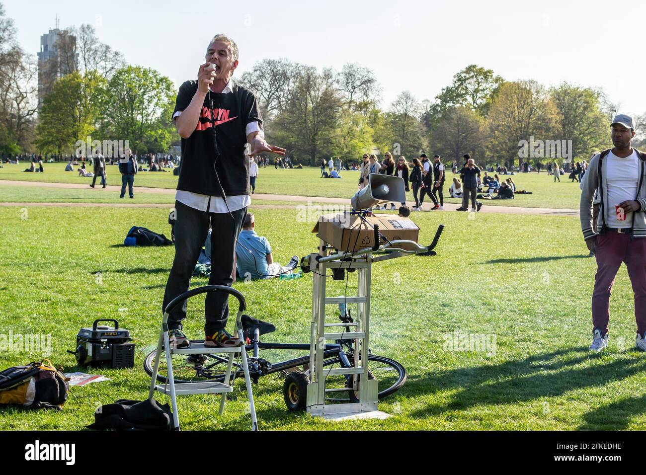 HYDE PARK, LONDON, ENGLAND- 24 April 2021: Heiko Khoo speaking at a ...
