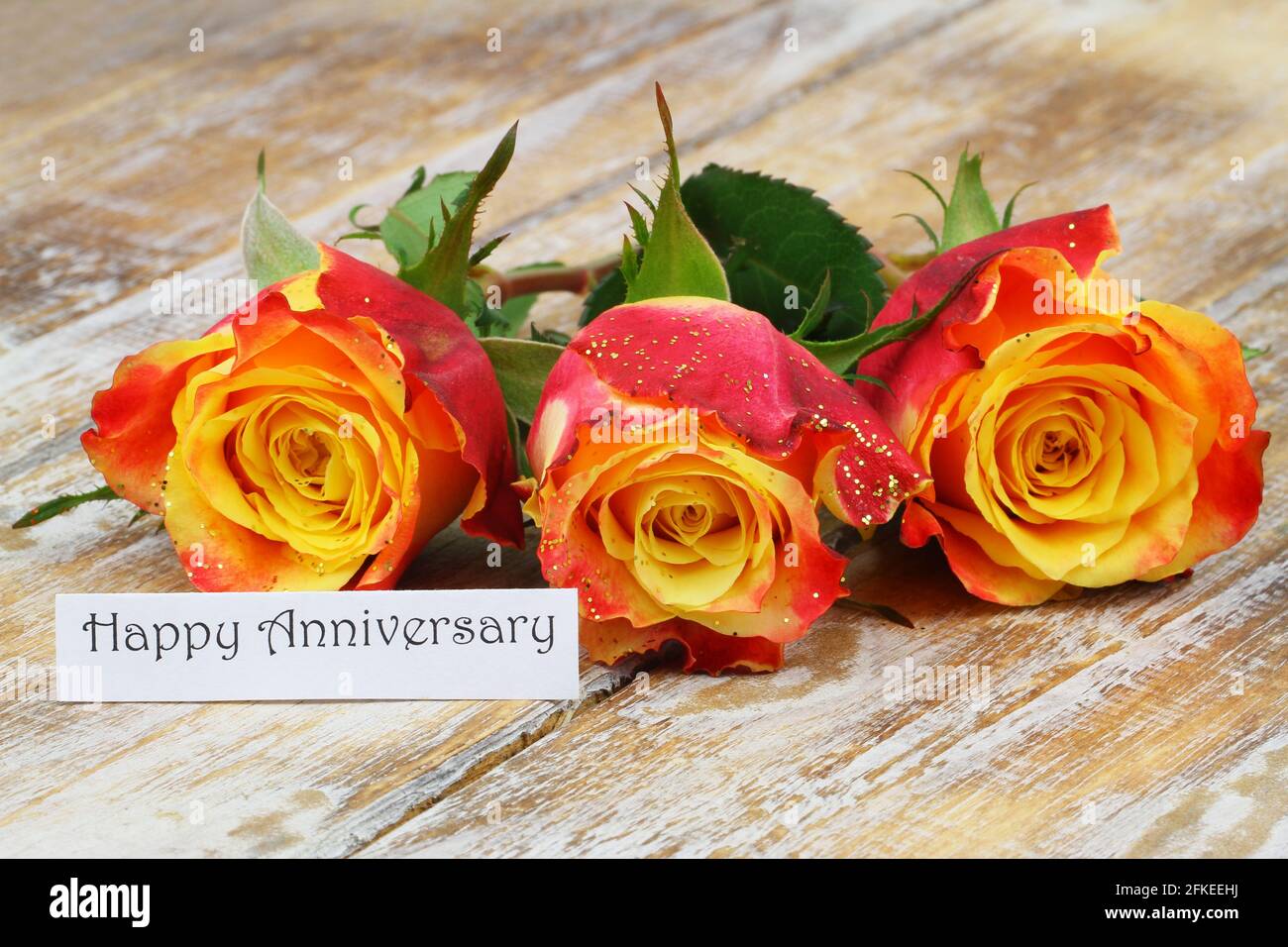Happy Anniversary card with three colorful roses covered in glitter on ...