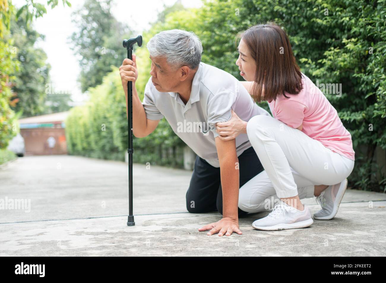 Asian senior man falling down at home in the backyard caused by ...