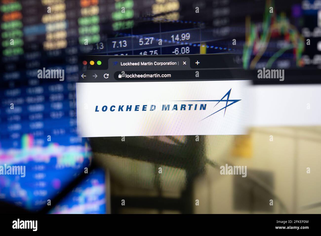 Lockheed Martin company logo on a website with blurry stock market ...