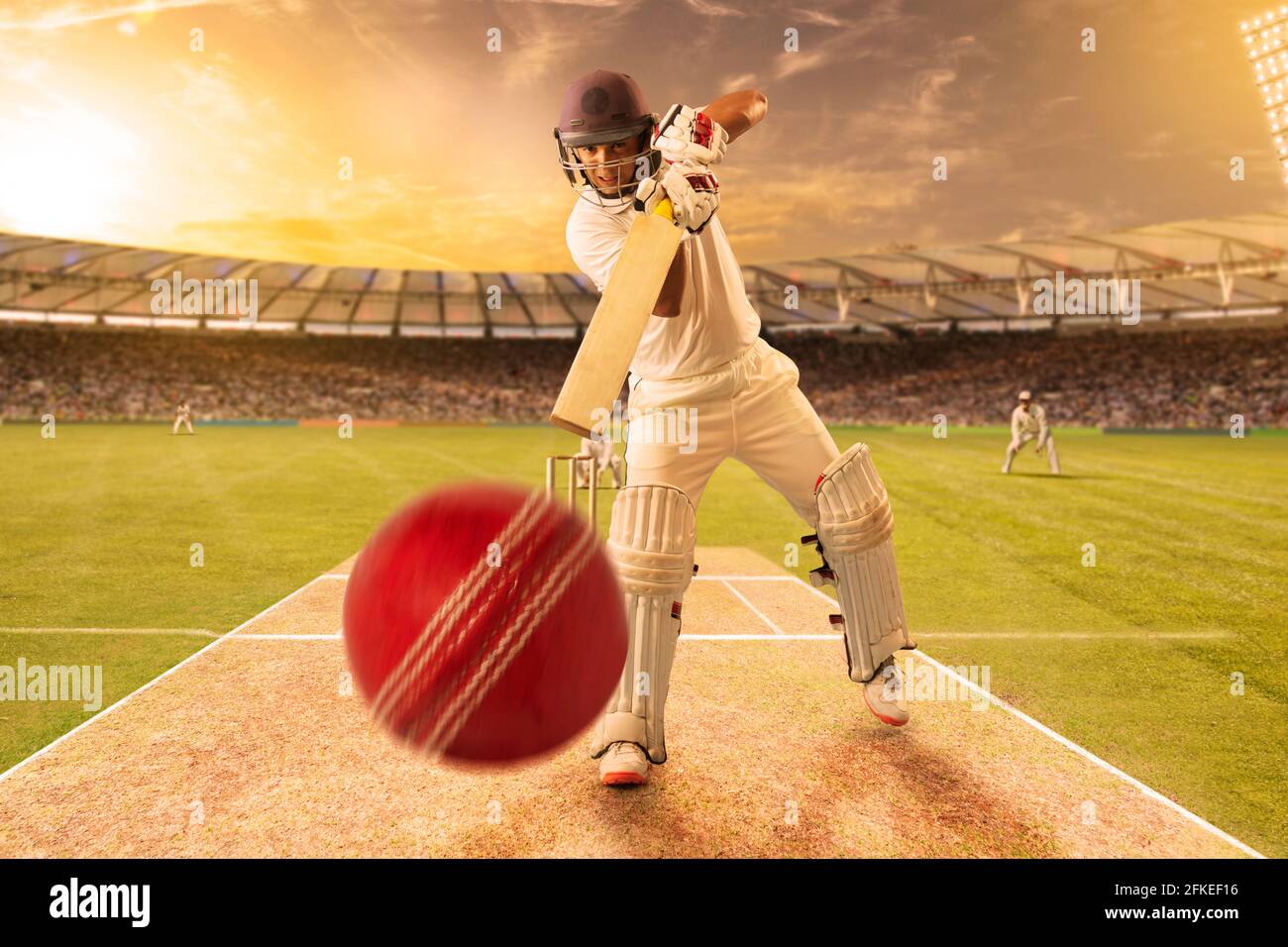 Cricketer batsman hitting a shot during a match on the pitch Stock ...