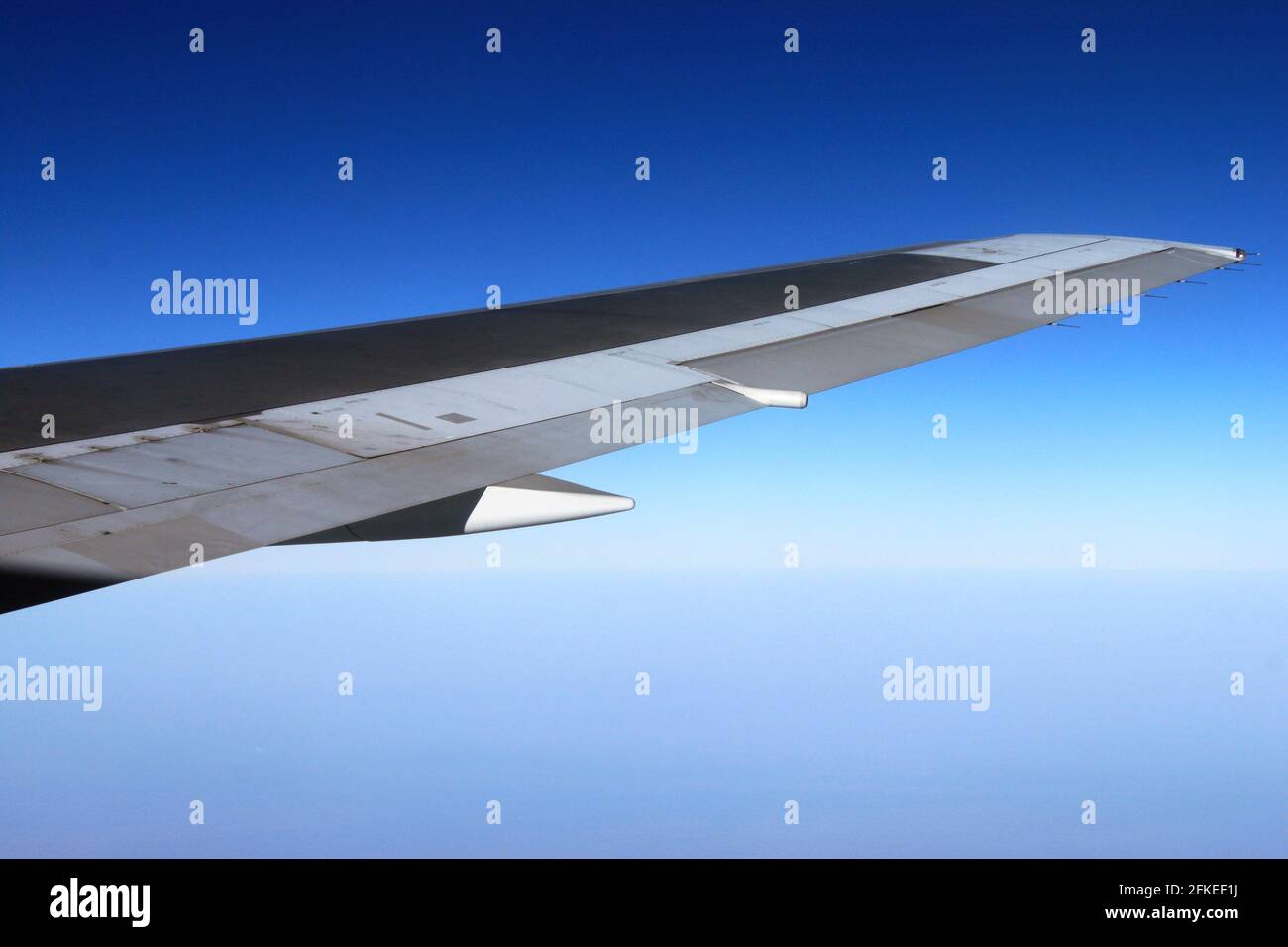 View of the wing of the airplane from the window during the flight ...