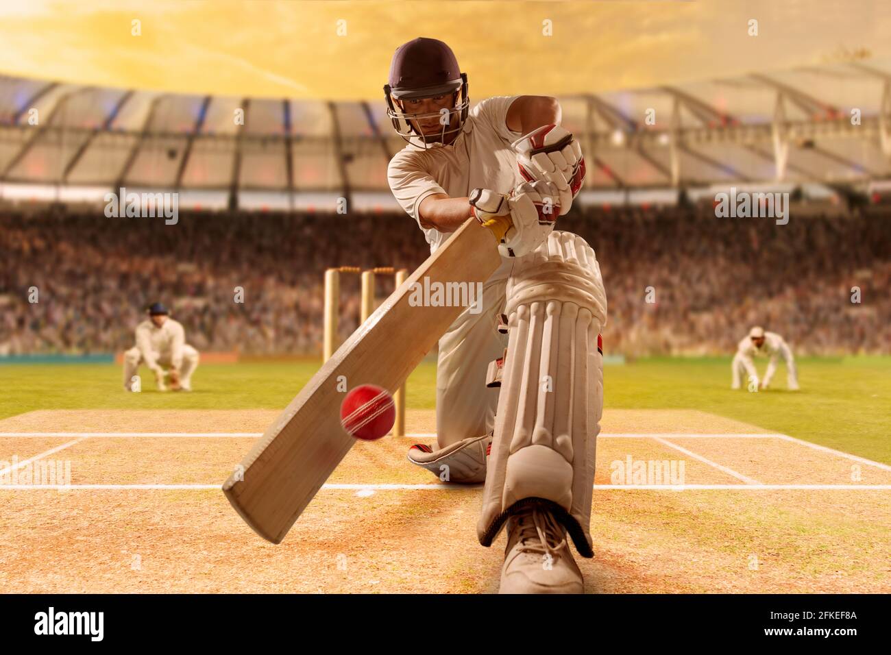 Cricketer batsman hitting a shot during a match on the pitch Stock ...