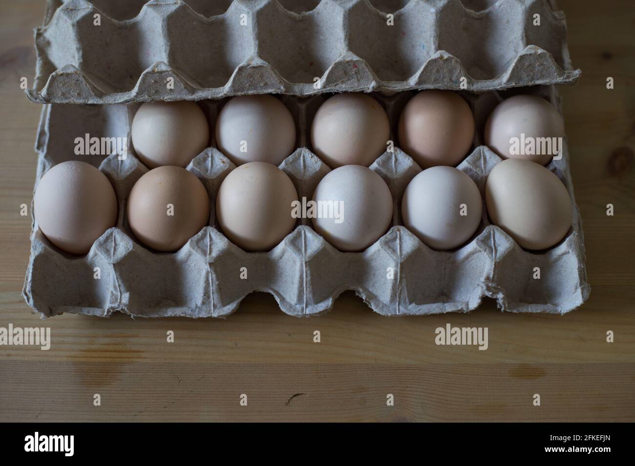 Top view of eggs in carton box Stock Photo - Alamy