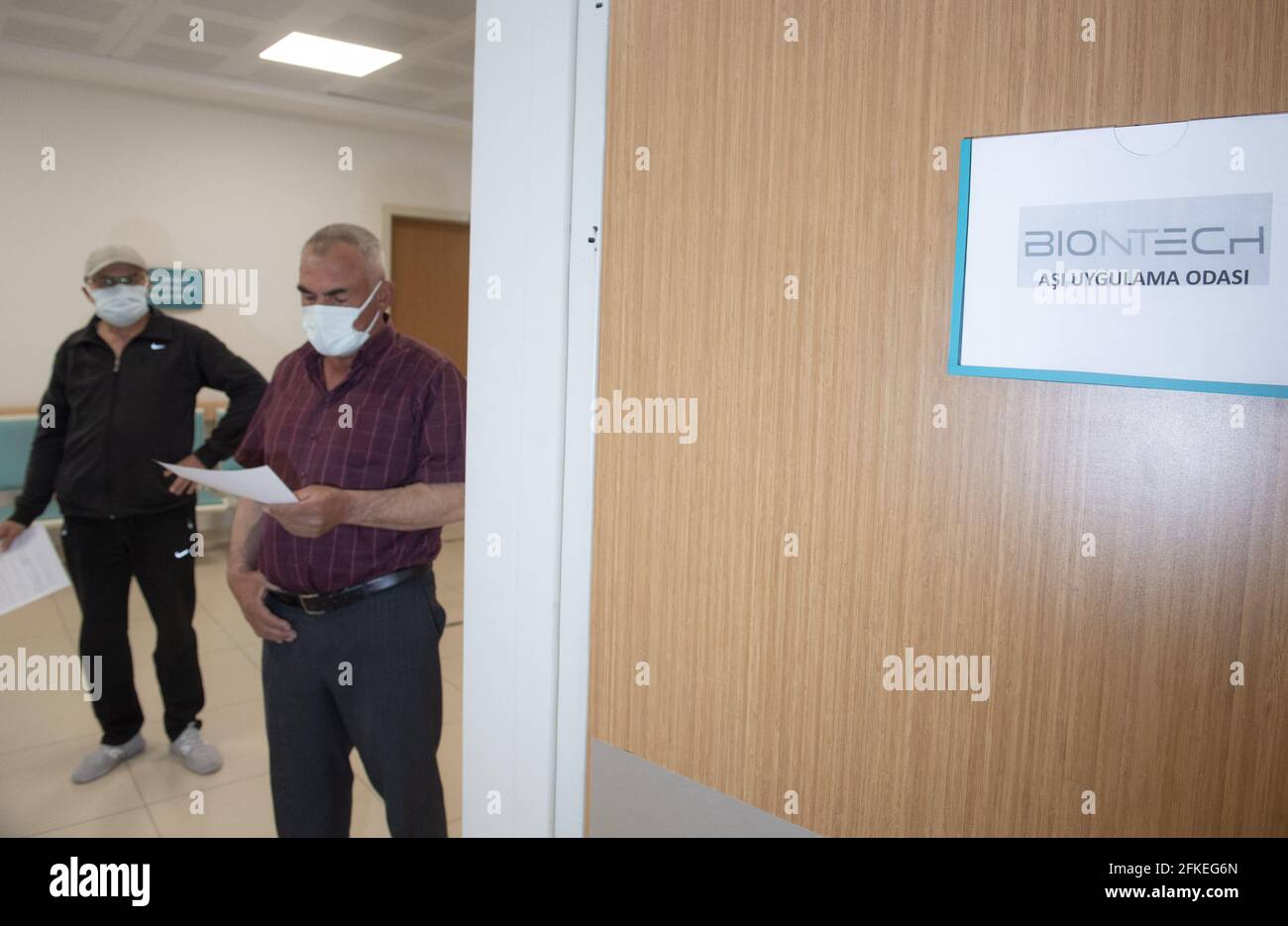 Turkish people wait for their turn for vaccination against COVID-19 ...