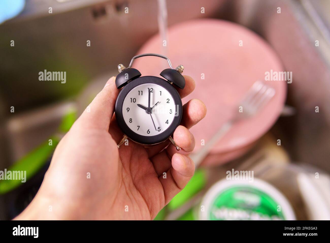 Man cleaning clock hi-res stock photography and images - Alamy