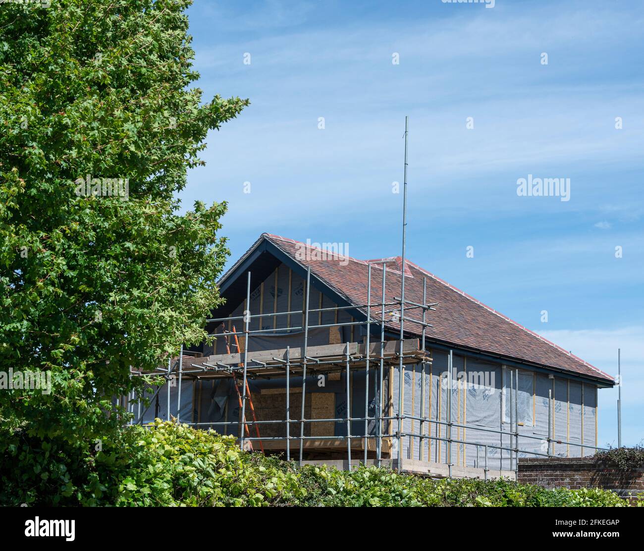 Scaffolding around a newly built house Stock Photo - Alamy