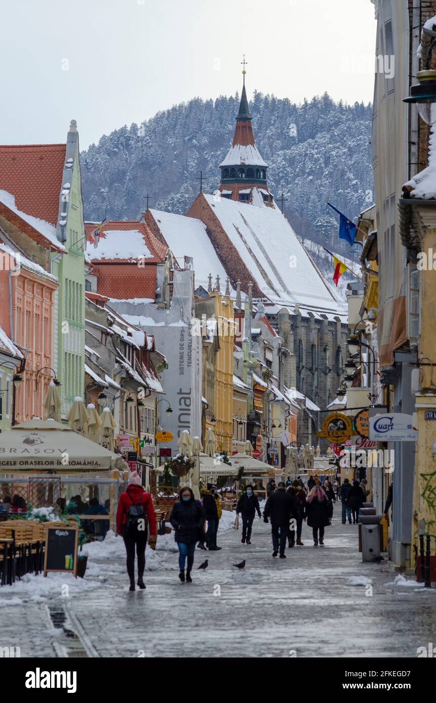 Shoppers amidst spring snow in Strada Republicii in the Historic Centre ...