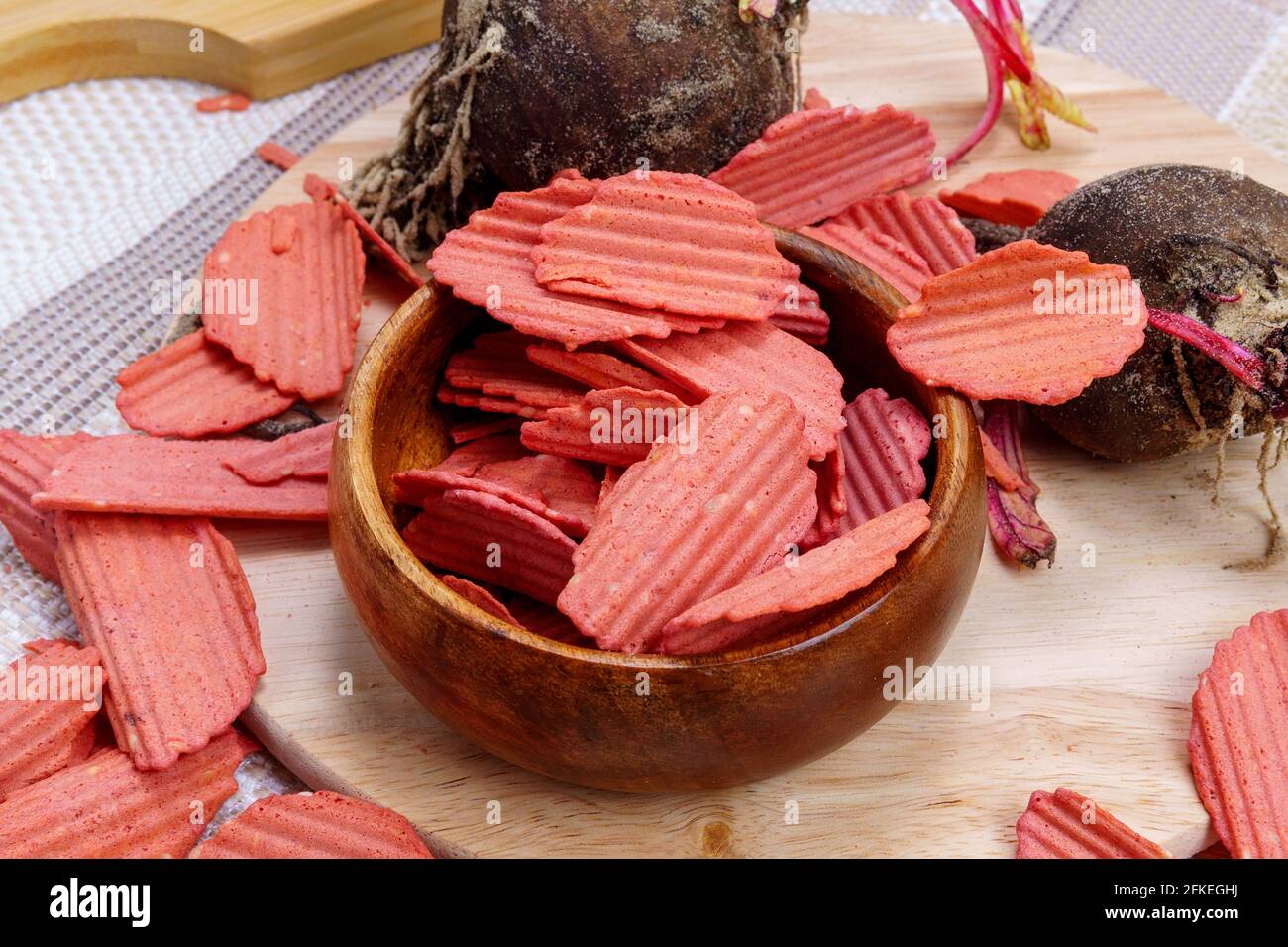 Bowl of healthy beet chips made from chickpea flour with sesame seeds ...
