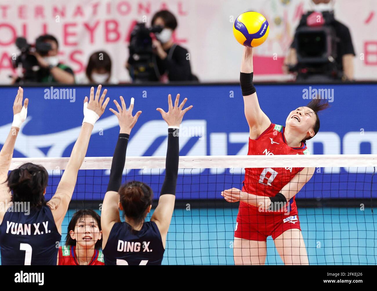 Japan's Mayu Ishikawa (R) spikes during the first set of a women's ...