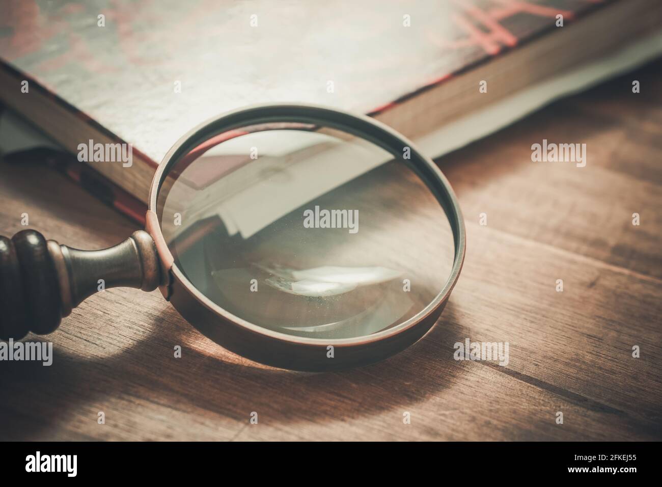 Vintage magnifier lying on hi-res stock photography and images - Alamy