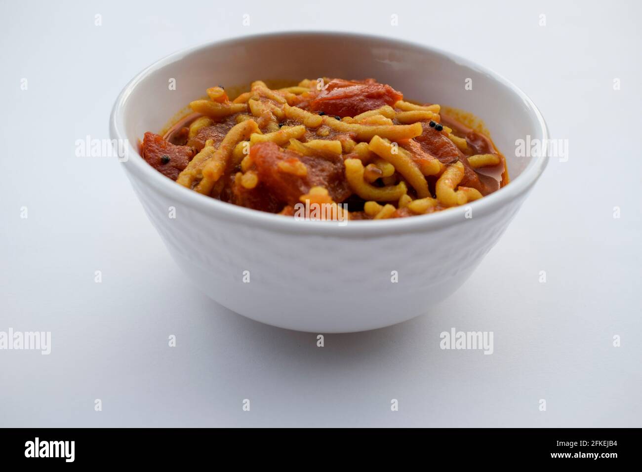 Famous and Authentic Gujarati food Sev tamatar or Sev tameta sabji made ...