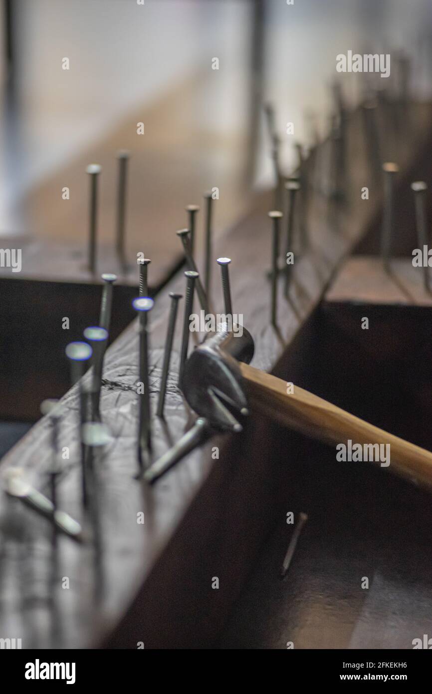Vertical shot of a vintage claw hammer next to panel pin nails Stock ...