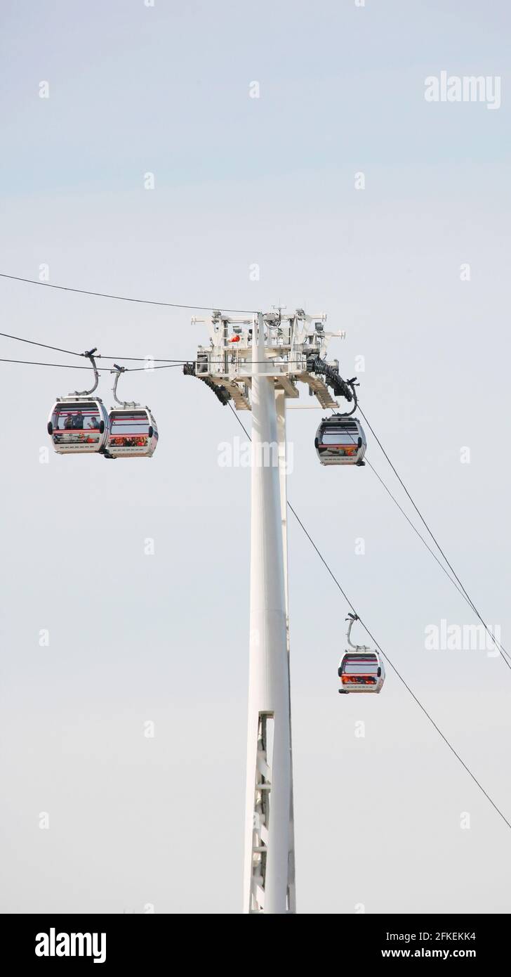 LONDON - MAY 26: Gondolas of the Emirates Air Line cable car, opened ...