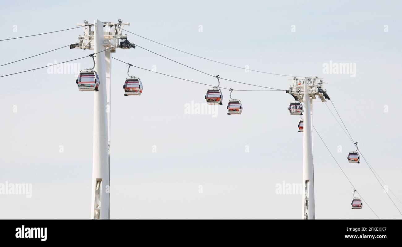 LONDON - MAY 26: Gondolas of the Emirates Air Line cable car, opened ...