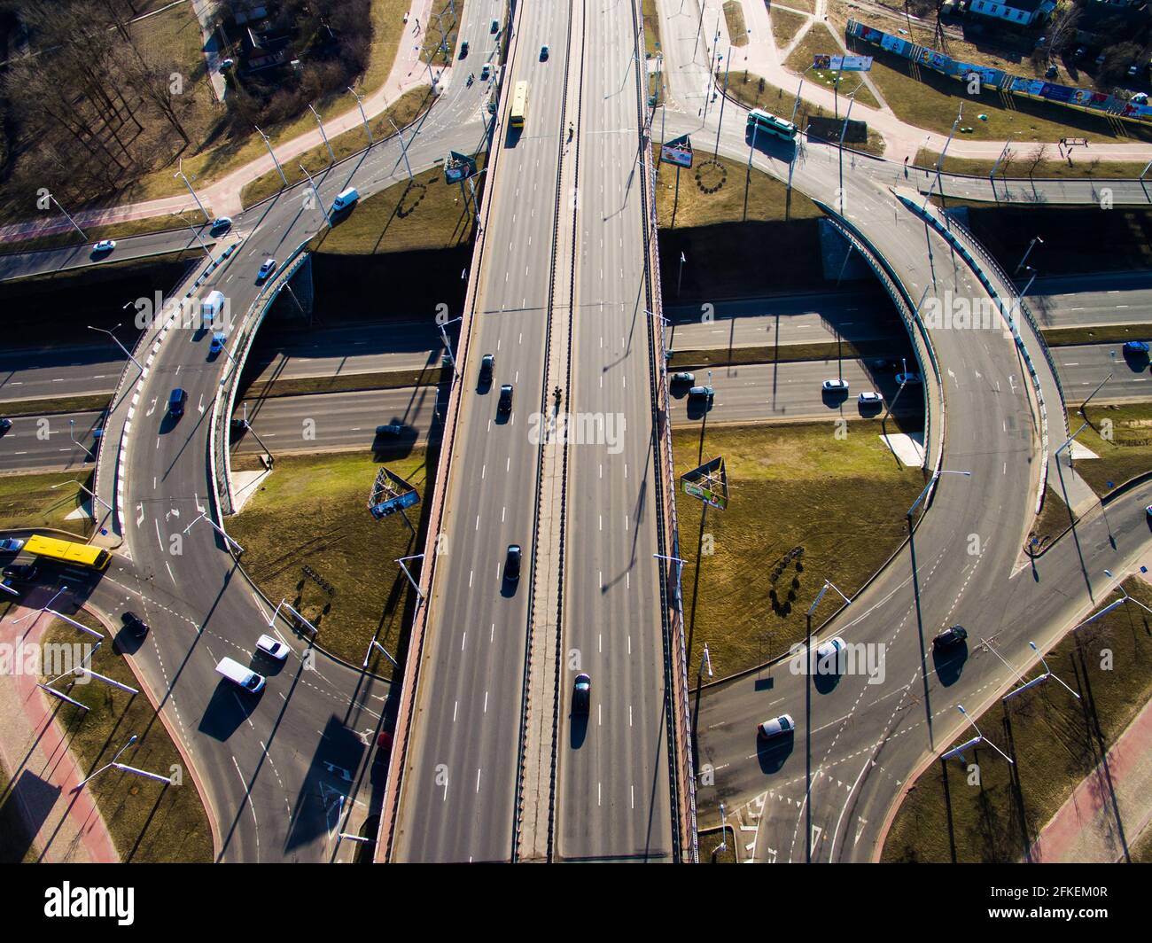 Aerial view at junctions of city highway. Vehicles drive on roads ...