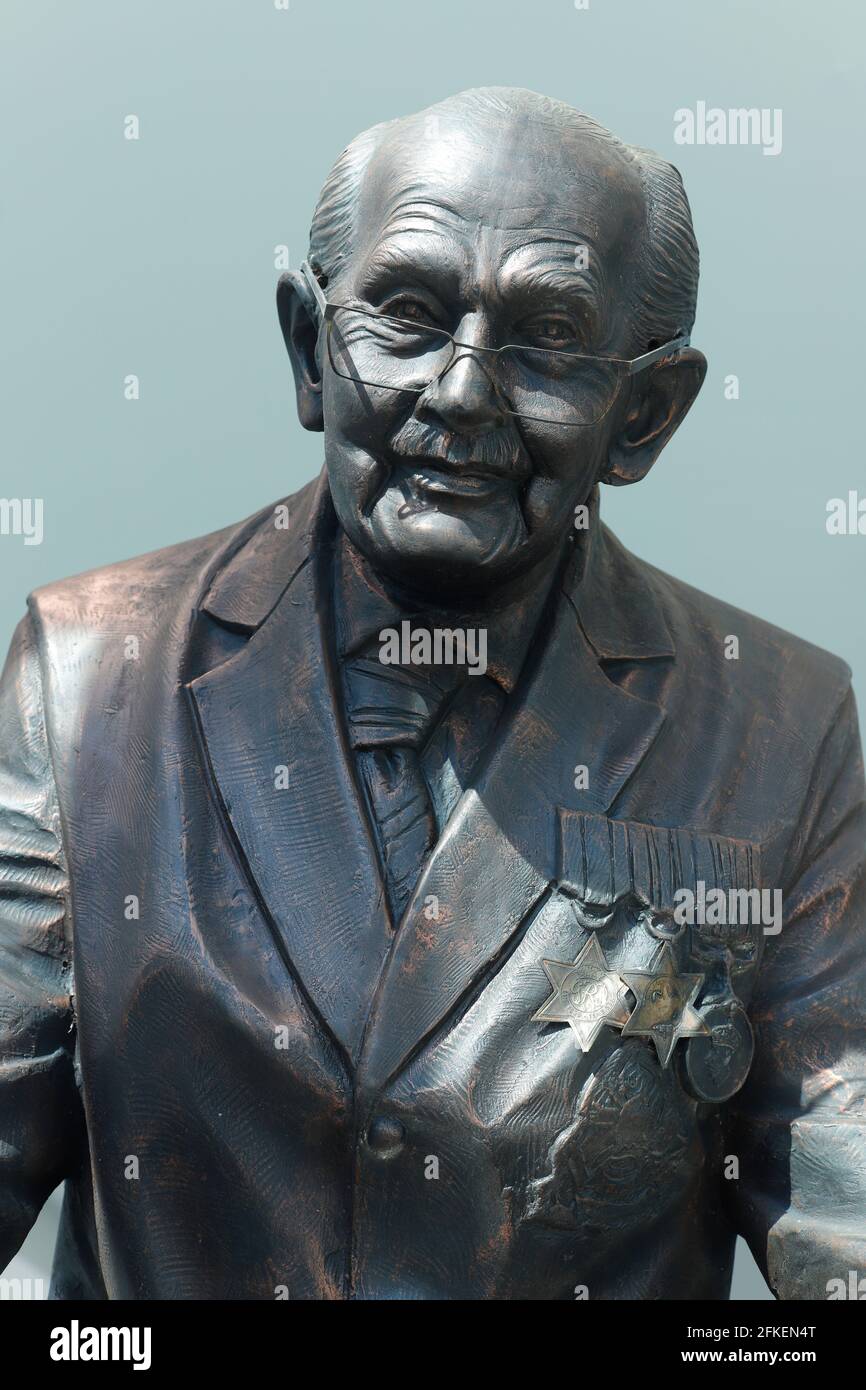 A resin statue of the late Sir Captain Tom Moore on display at Clark ...