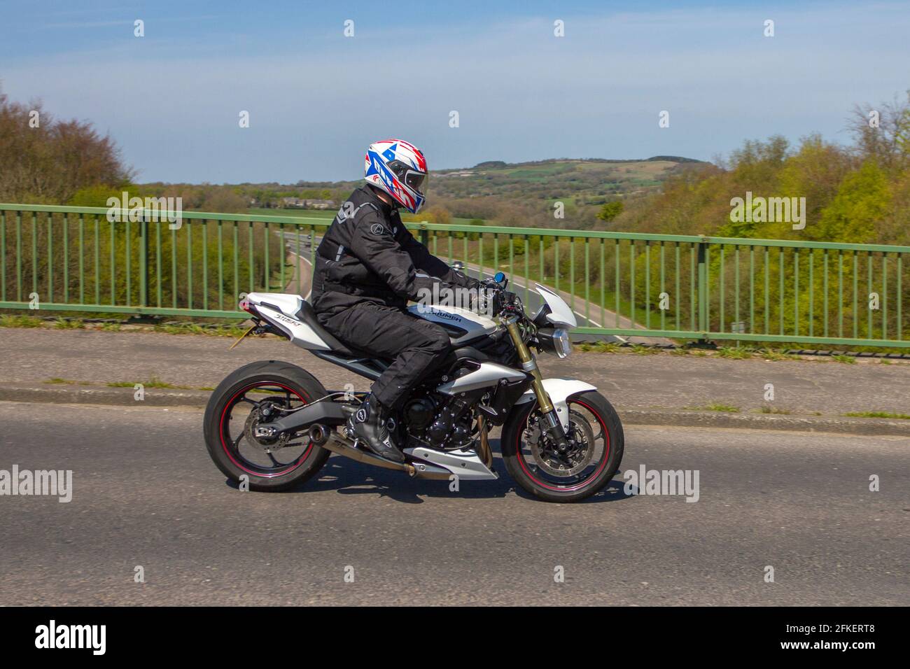Triumph white street triple; Motorbike rider; two wheeled transport ...