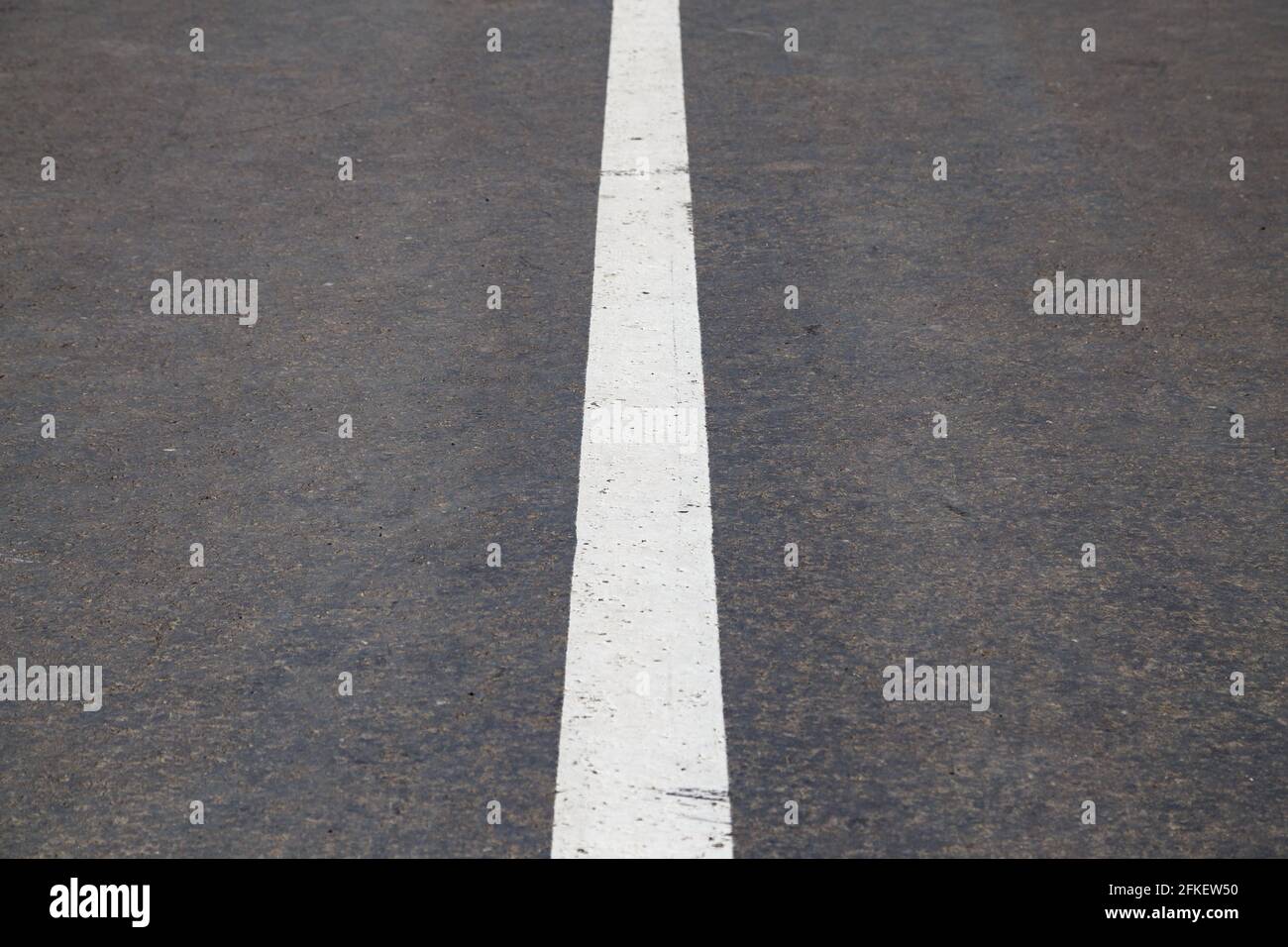 Photo of road markings on gray asphalt Stock Photo - Alamy