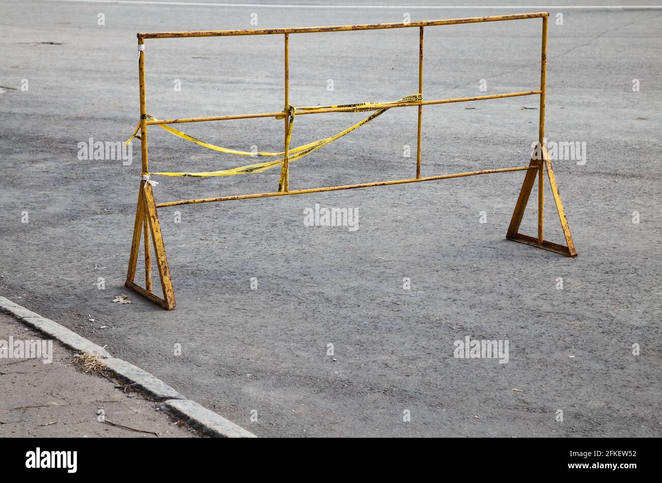 Image of yellow metal fence on the road Stock Photo - Alamy