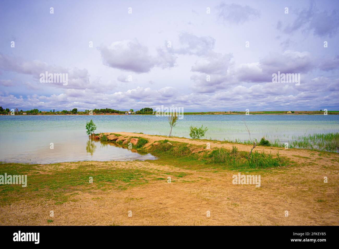 Beautiful lagoon lake seen through the shore under the cloudy sky Stock ...