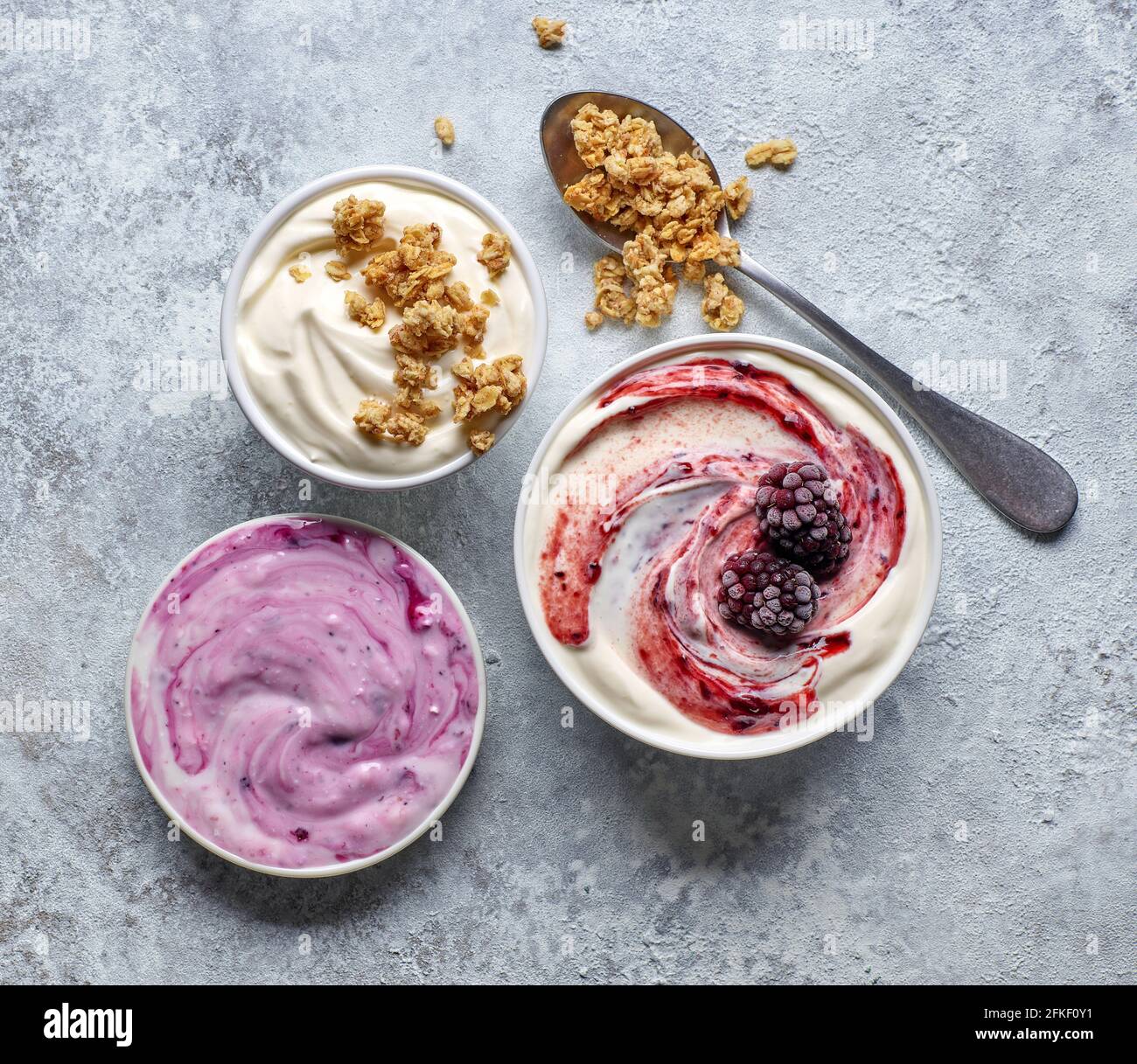 bowls of various greek yogurt on kitchen table, top view Stock Photo ...