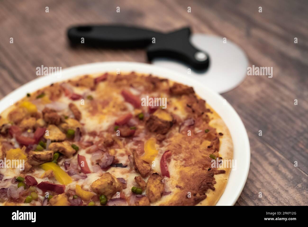 Close up and selective focus of a home cooked thin crust sweet chilli ...