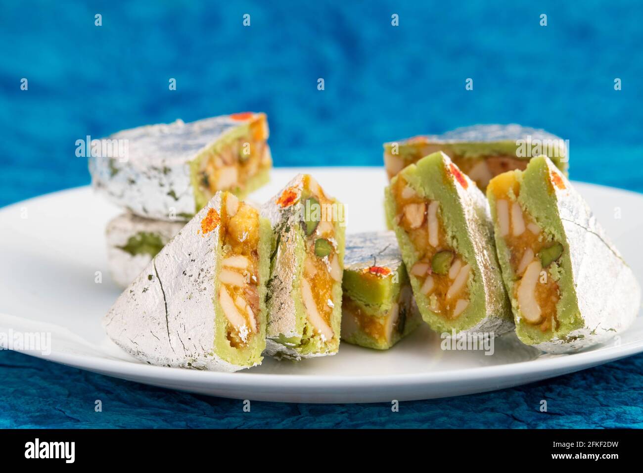 Indian dessert silver plate hi-res stock photography and images - Alamy