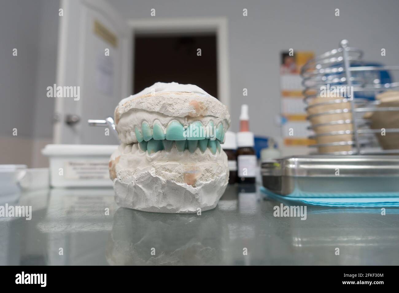 modeling of artificial teeth on a plaster model for visual display ...