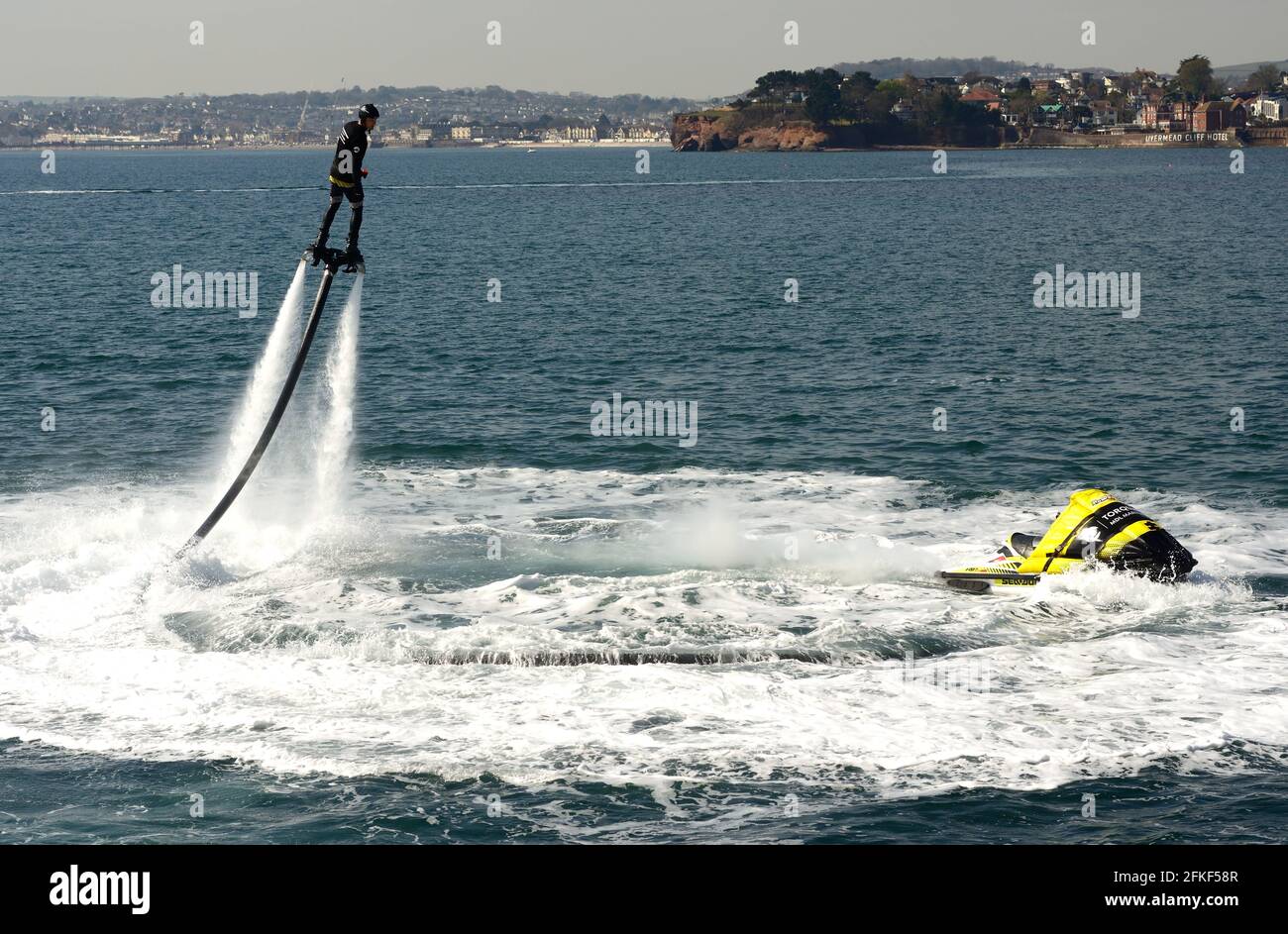 A fly-boarder in action along the seafront at Torquay in Devon Stock ...