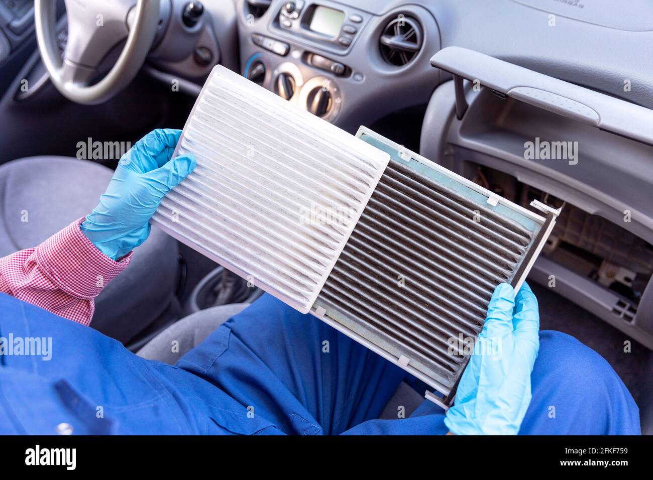 Replacement of cabin pollen air filter for a vehicle Stock Photo - Alamy