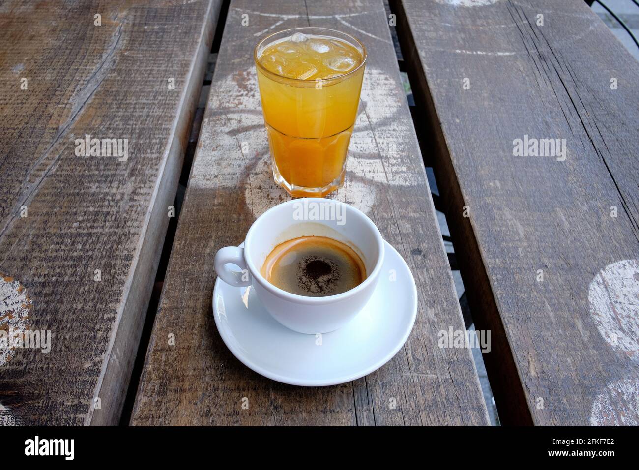 Cup of coffee and a glass of fresh orange juice on a wooden board Stock ...