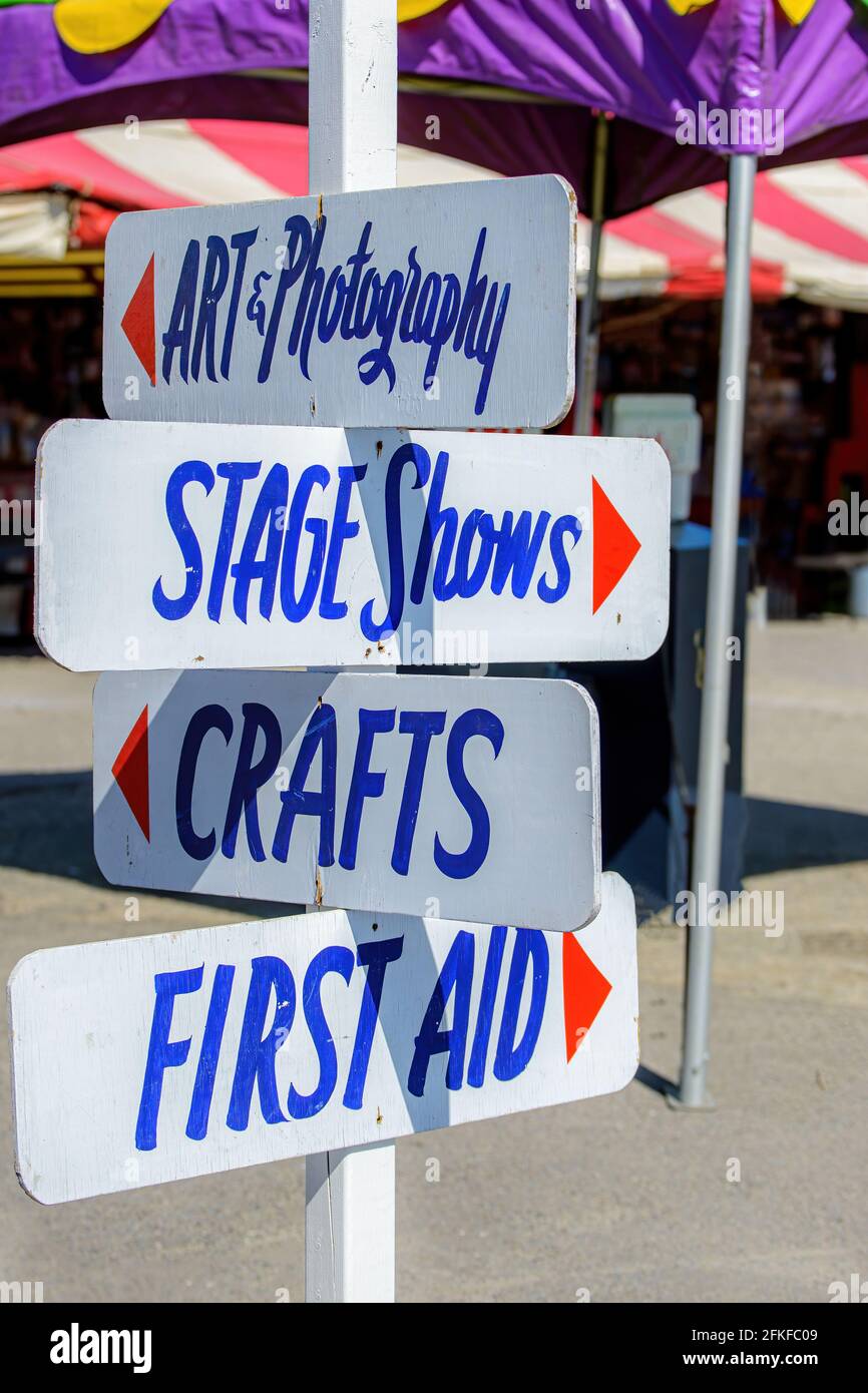 Signs at a fair showing the direction for Art & Photography, Stage ...