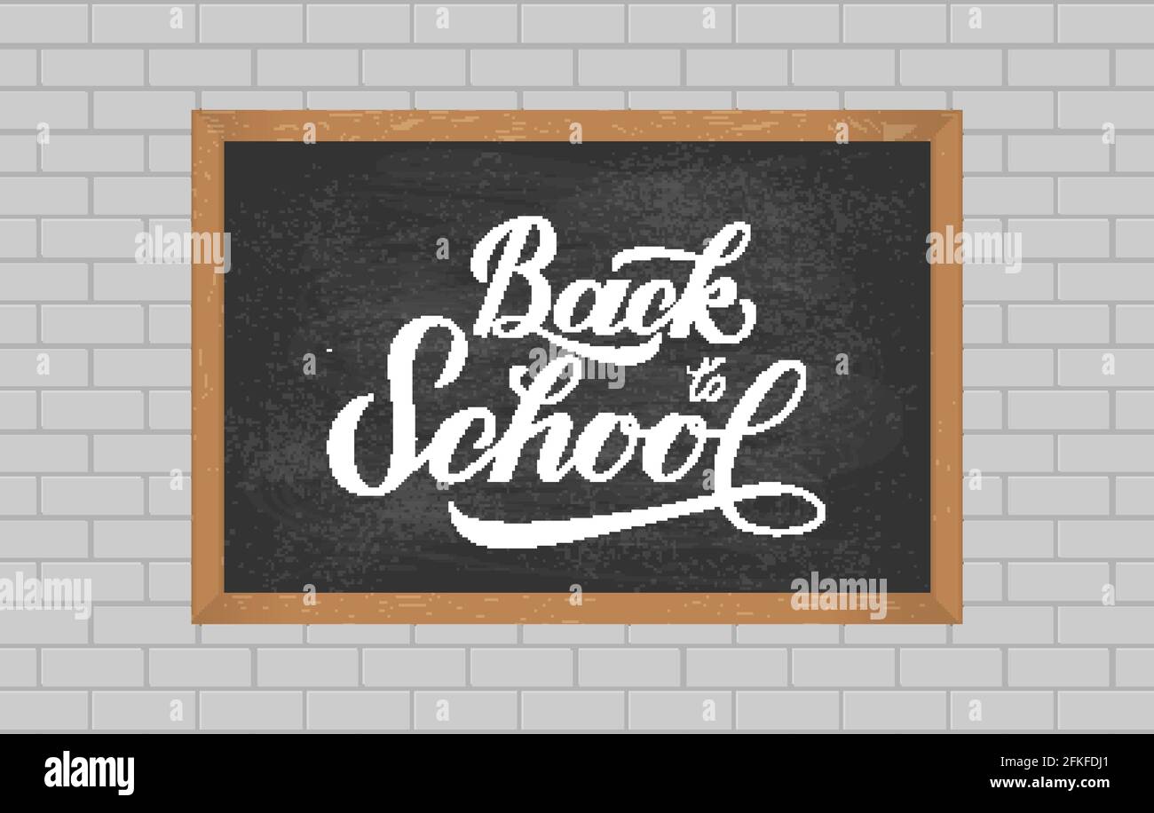 Chalkboard with wood frame on brick wall of classroom. Back to school ...