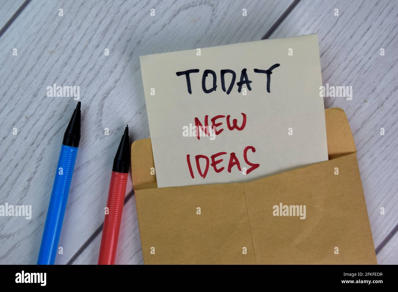 Today New Ideas text on document above brown envelope and stethoscope ...