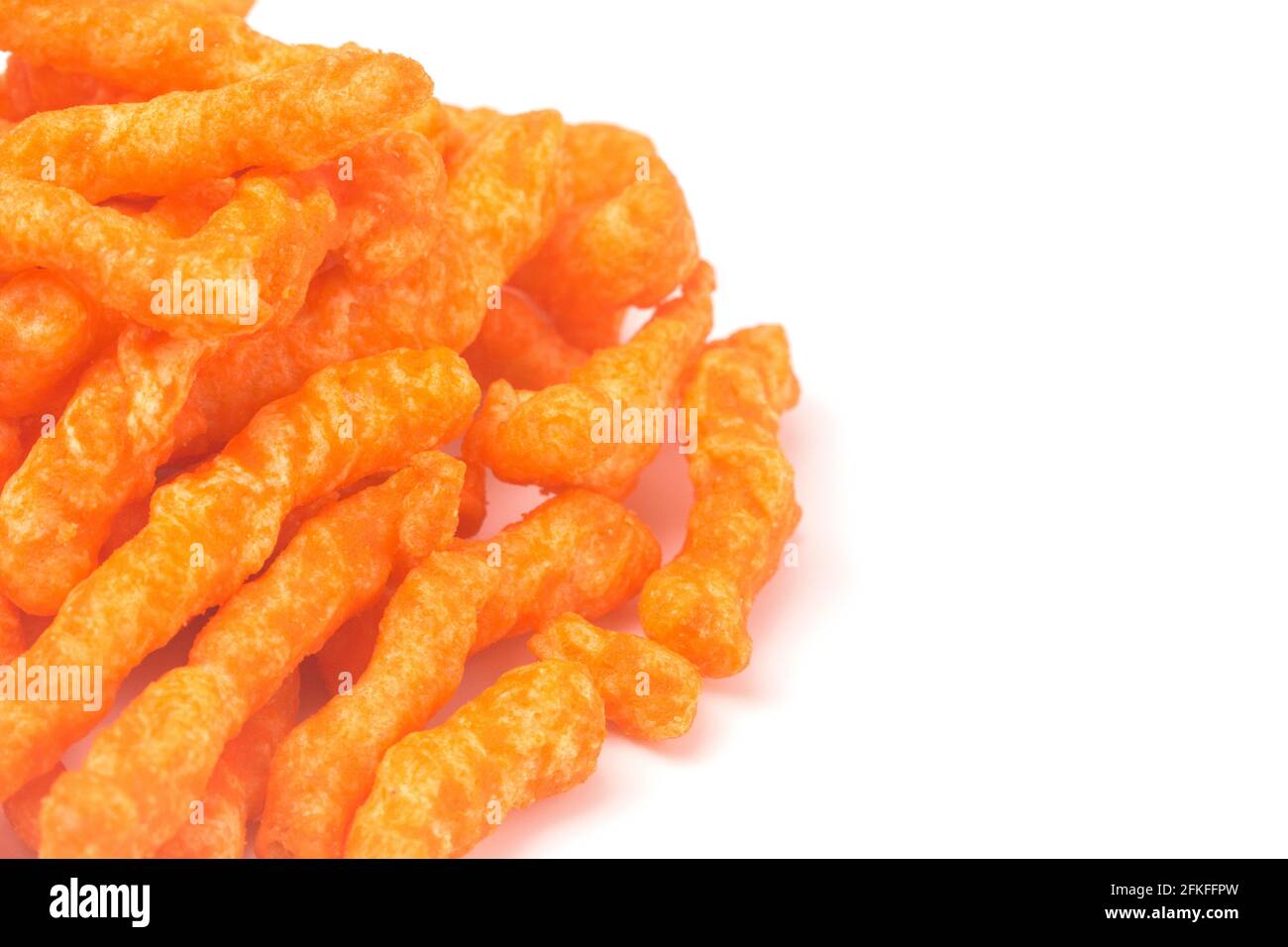 Long and Thing Crunchy Orange Cheesy Chips on a White Background Stock ...