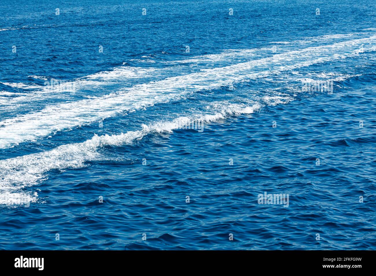Boat tail on sea water . Summer vacation sailing cruise . Trail on the ...