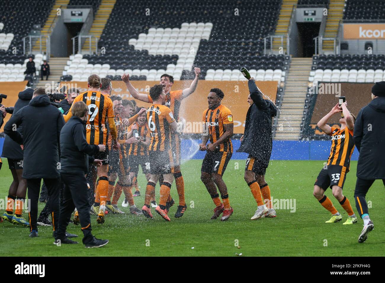 Hull City players celebrate on the pitch after the final whistle with ...