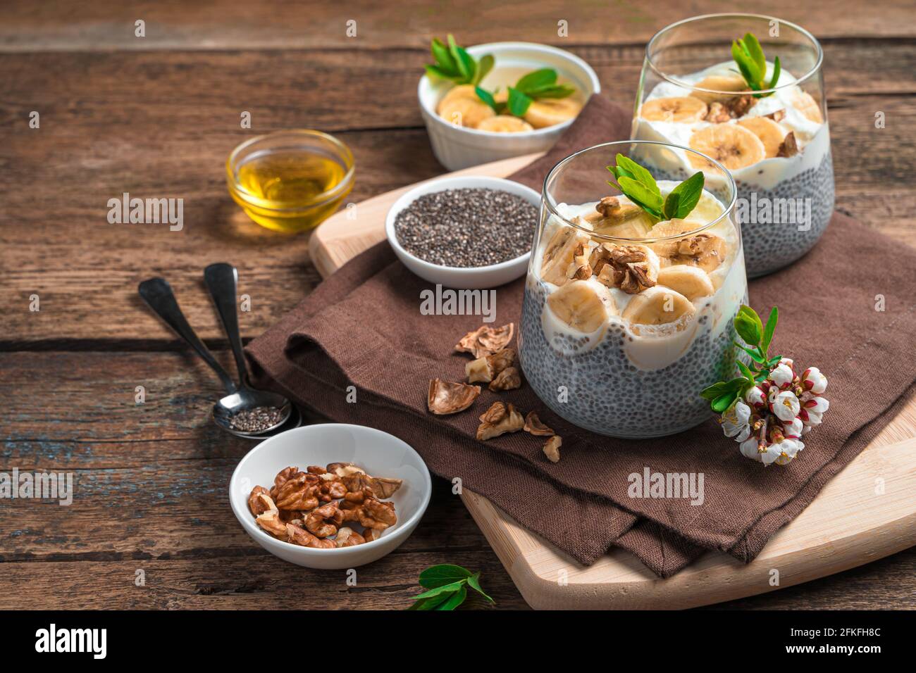 Healthy pudding with coconut milk, chia seeds, banana, nuts and honey ...