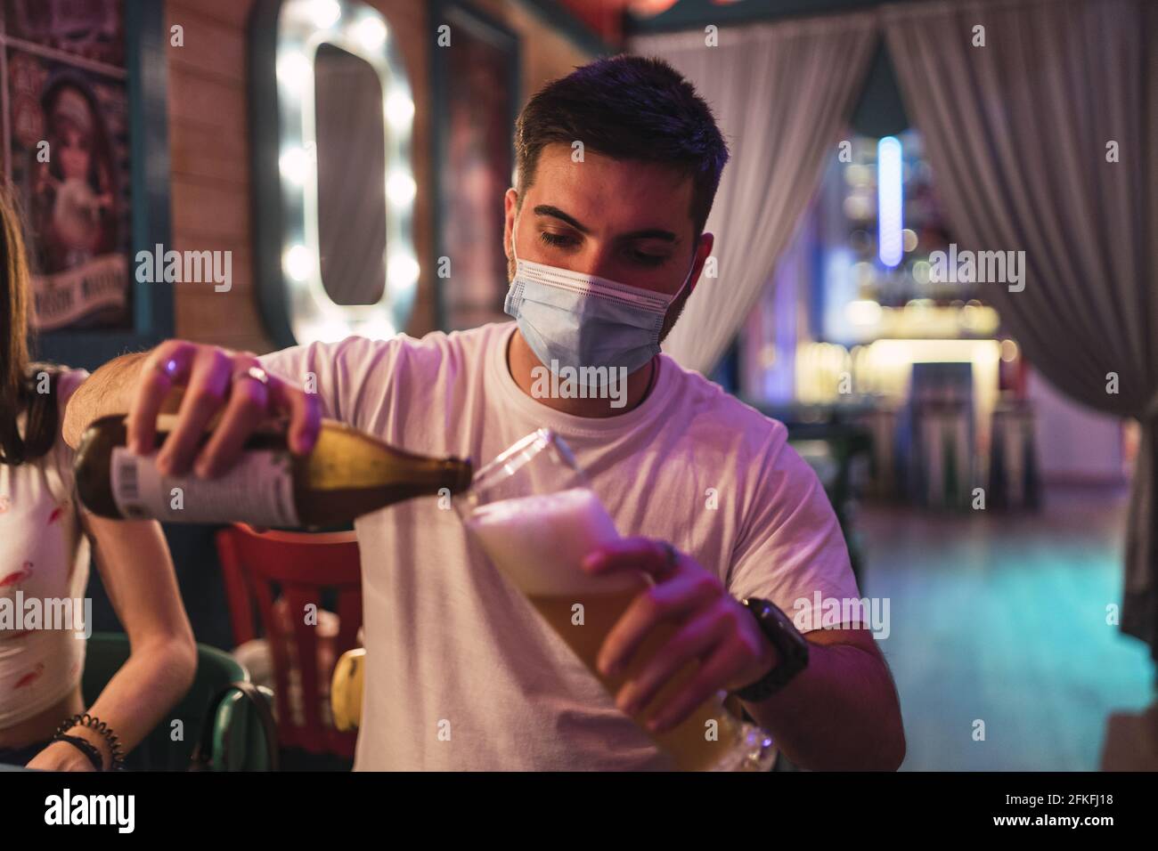Male friends pouring beer hi-res stock photography and images - Alamy