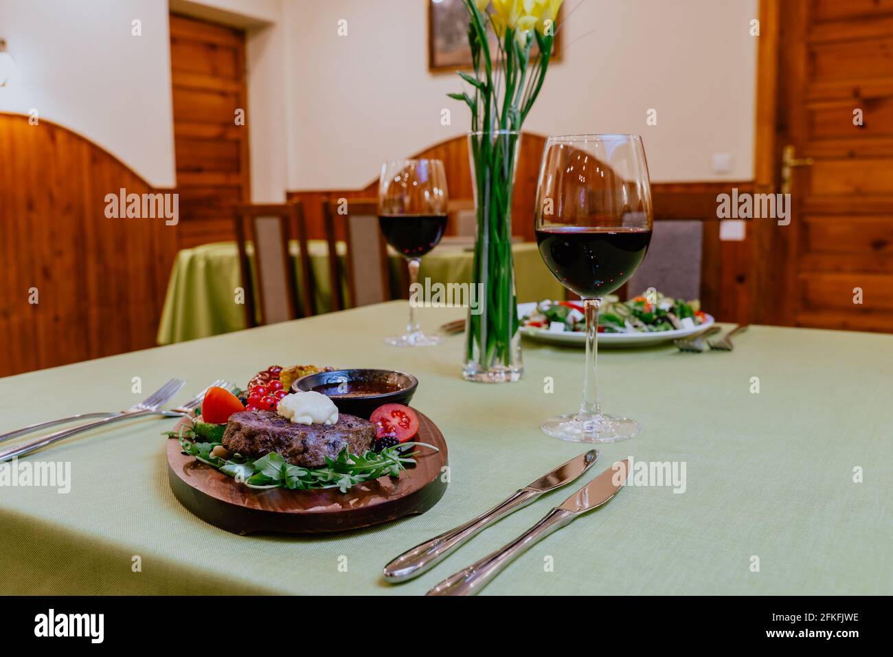 Healthy dinner table for two, with plates of tasty appetizing food and ...