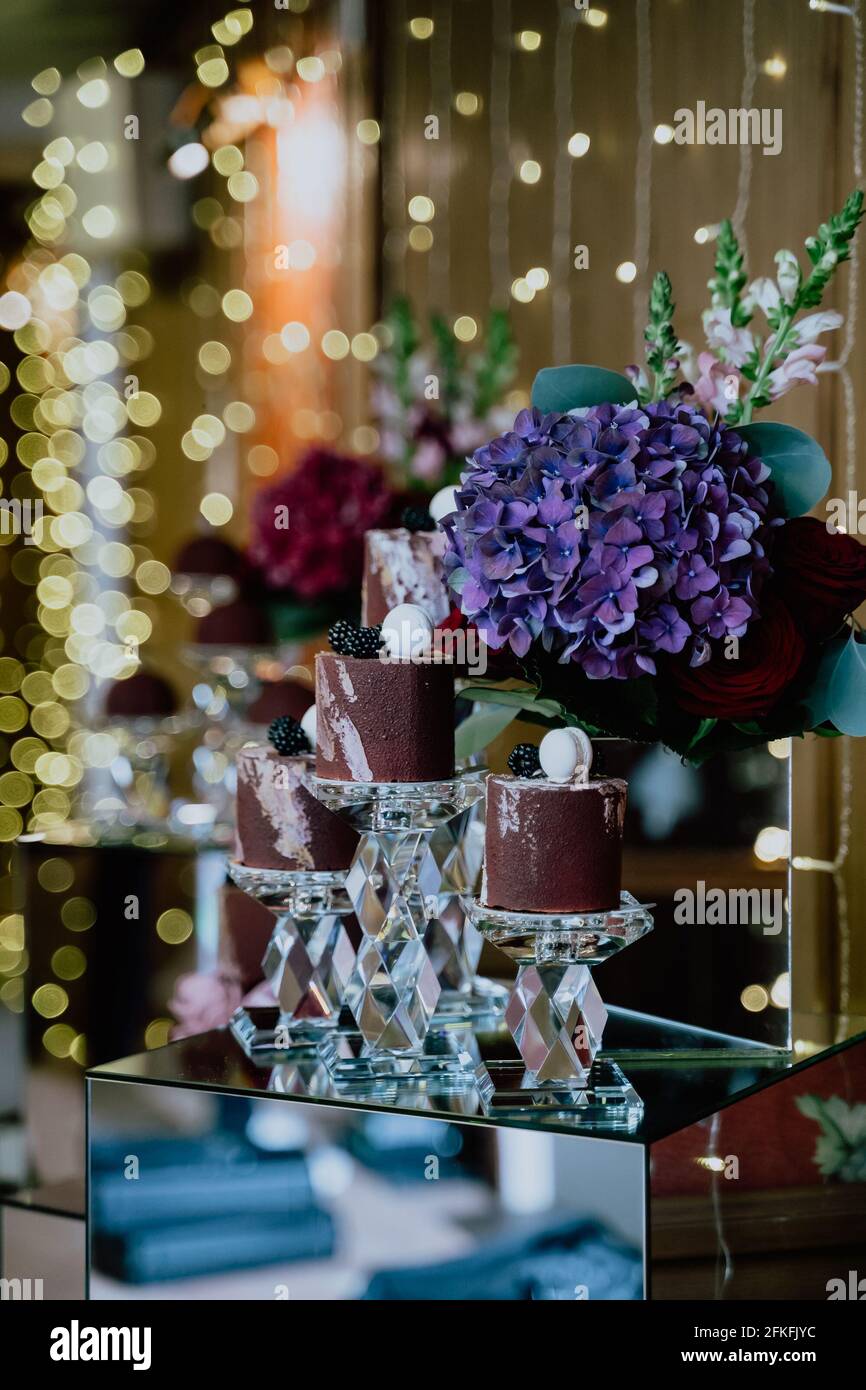 Vertical shot of a dessert corner of a restaurant with sweets and ...