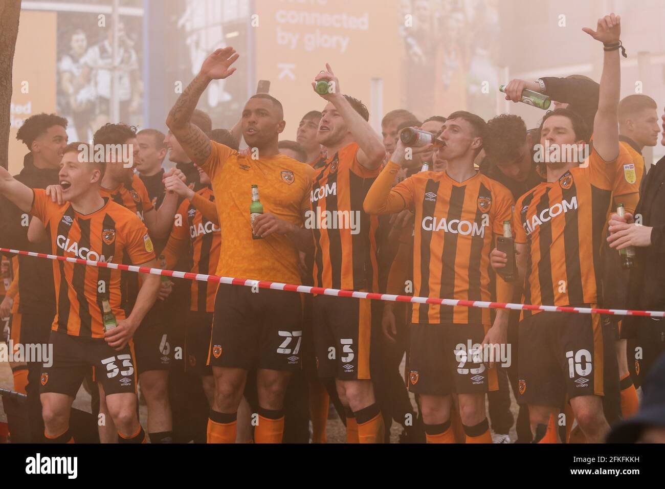Hull City players celebrate outside the KCOM Stadium in front of the waiting fans Stock Photo ...