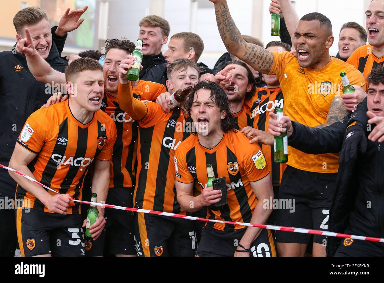 Hull City players celebrate outside the KCOM Stadium in front of the waiting fans Stock Photo ...
