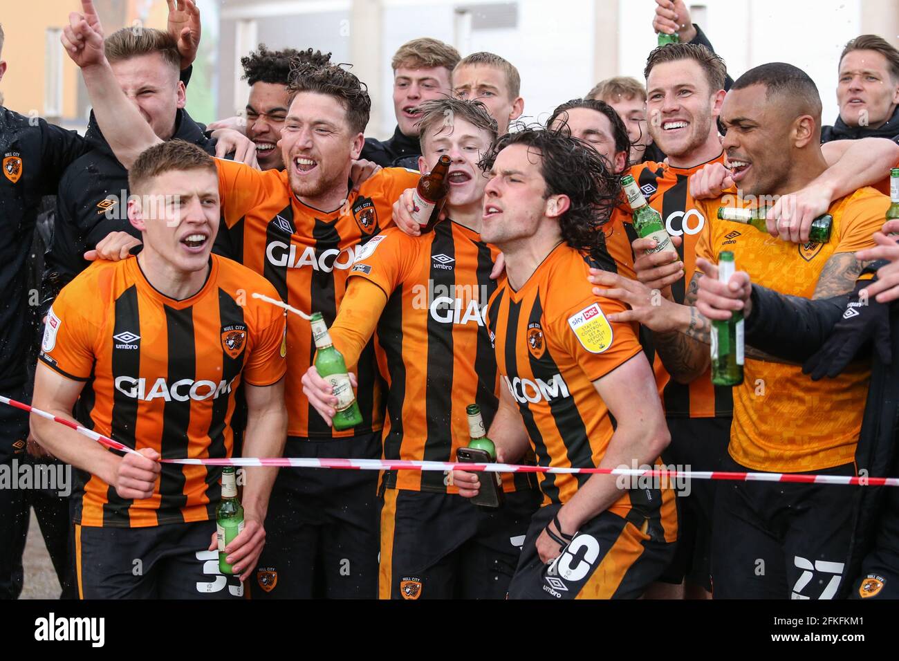 Hull City players celebrate outside the KCOM Stadium in front of the waiting fans Stock Photo ...