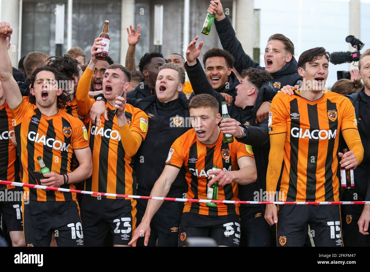 Hull City players celebrate outside the KCOM Stadium in front of the waiting fans Stock Photo ...