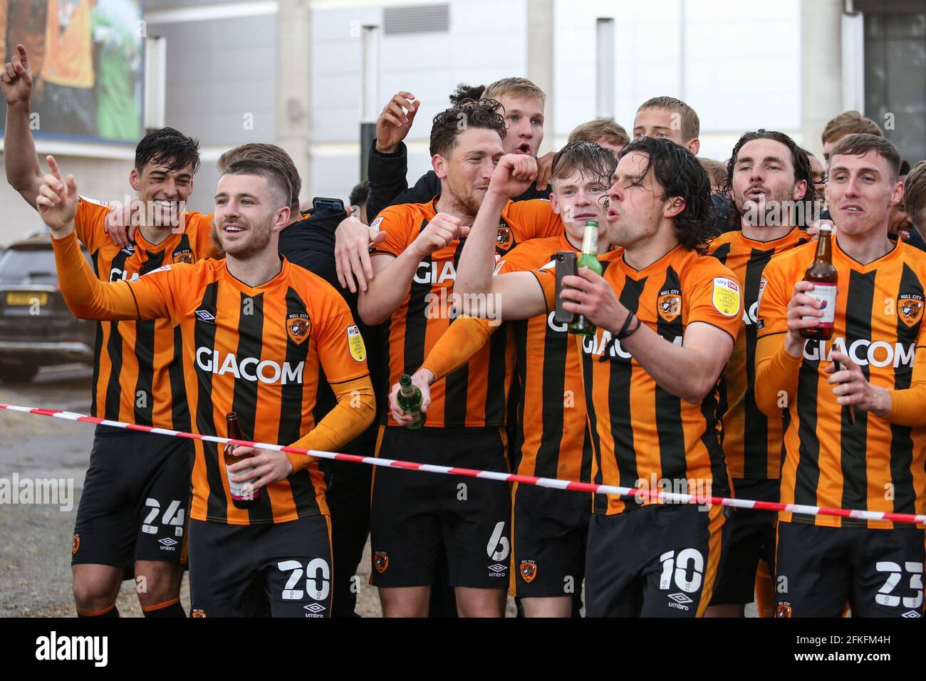 Hull City players celebrate outside the KCOM Stadium in front of the waiting fans Stock Photo ...