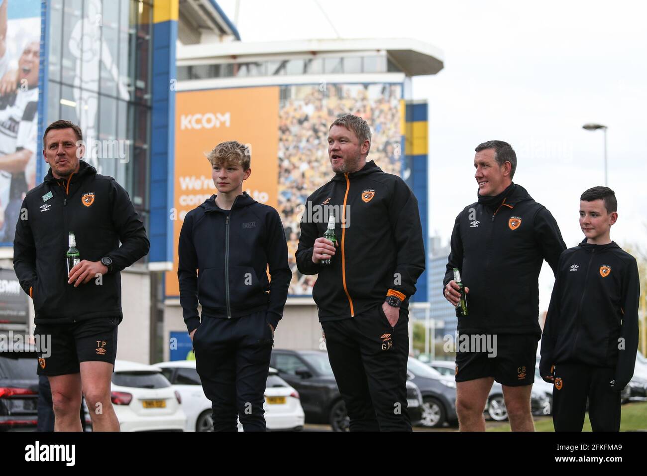 Hull City senior management team celebrate with a beer outside the KCOM Stadium Stock Photo - Alamy