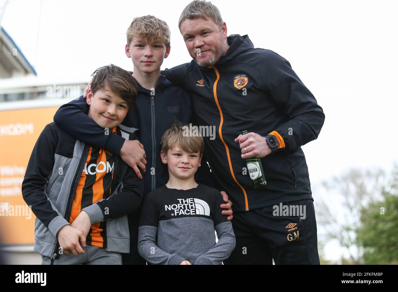 Grant McCann manager of Hull City poses for a photo with his sons outside the KCOM Stadium Stock ...