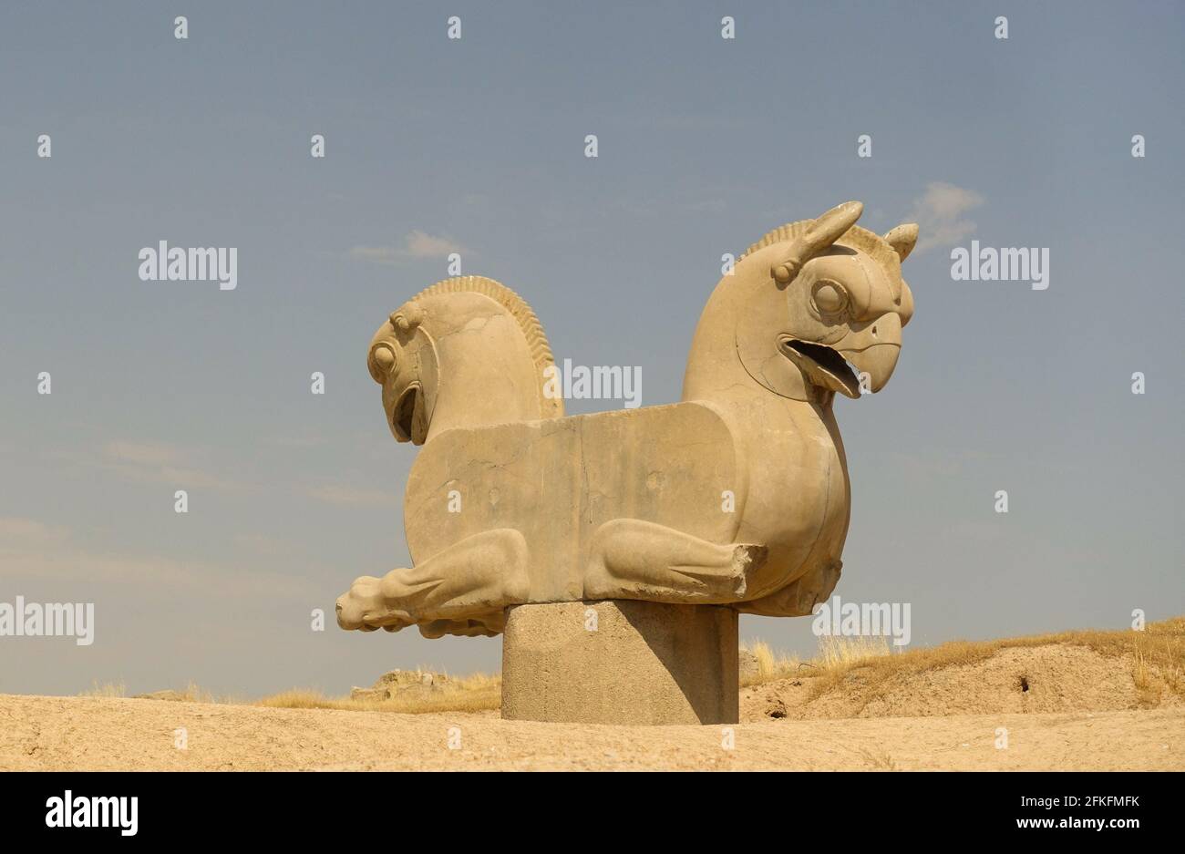 Two-headed griffin statue in the ancient ruins of an old city ...